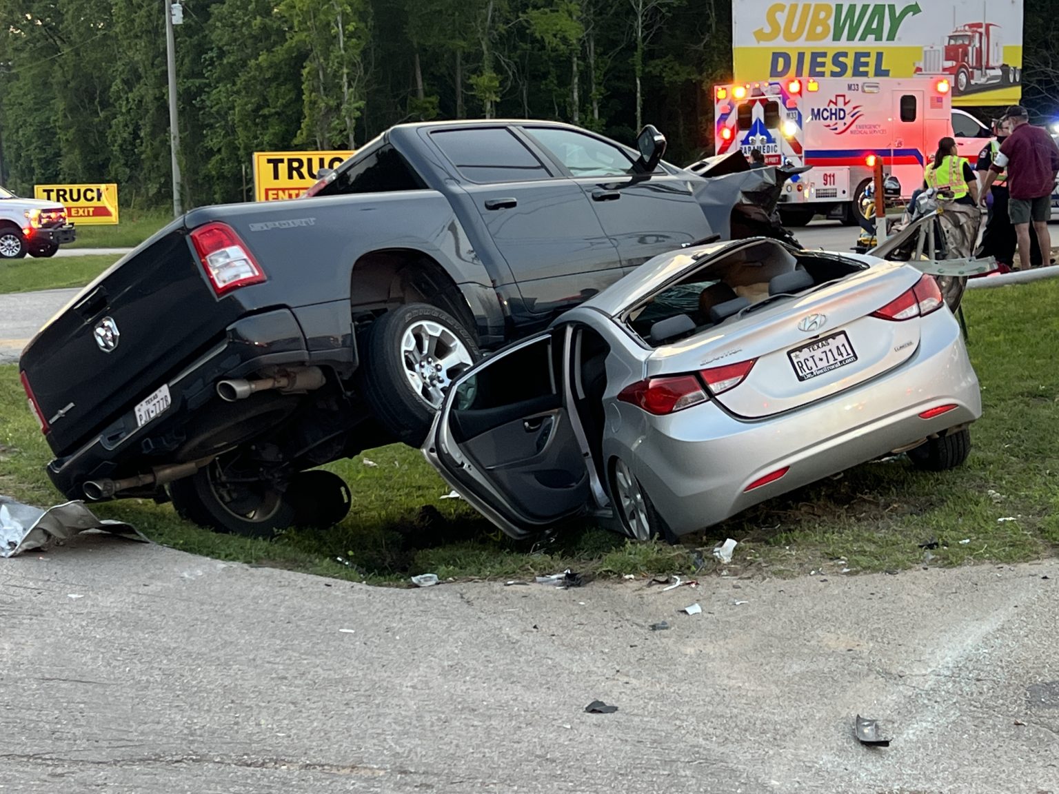 Pick up truck lands on car in SH 105 East crash in Montgomery County, TX